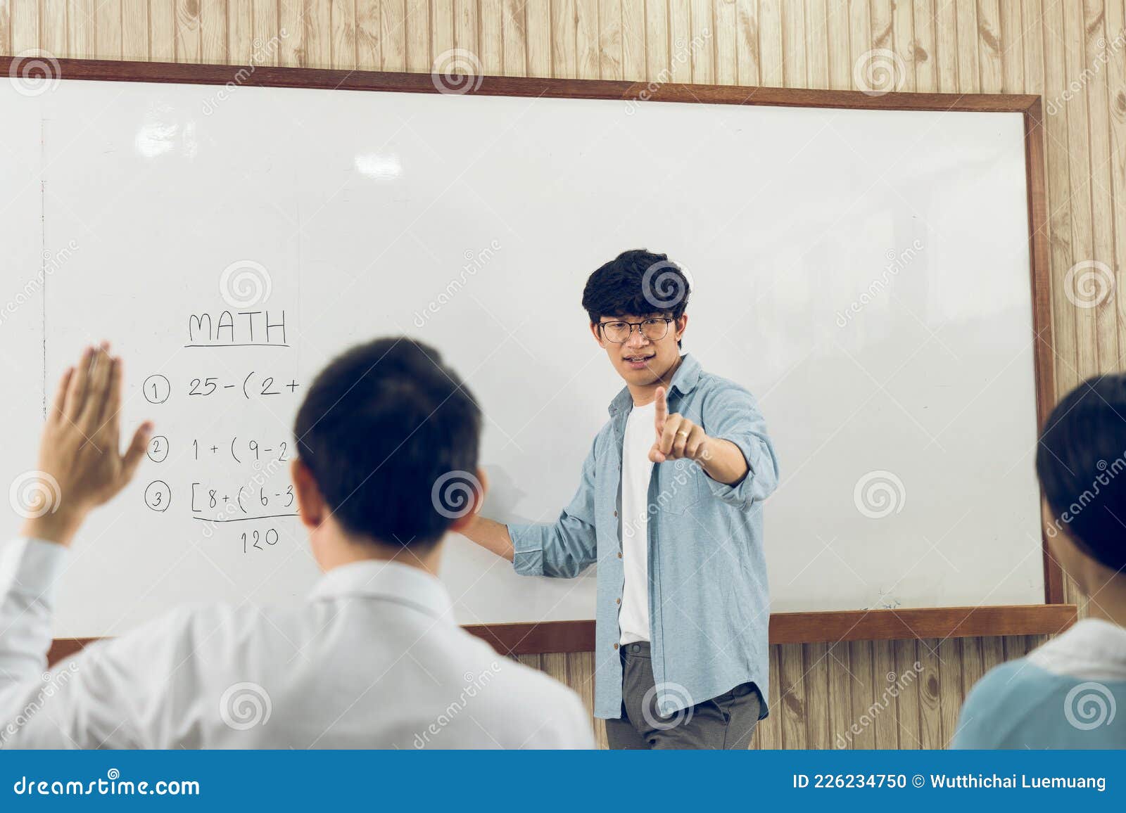 Asian Male Teacher Teaching Students at the Classroom Stock Photo ...