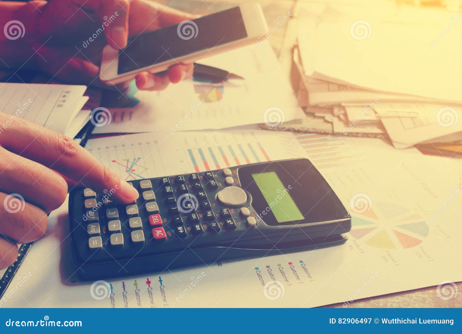 Asian Man Calculating about Cost and Using Smartphone Searching Stock ...