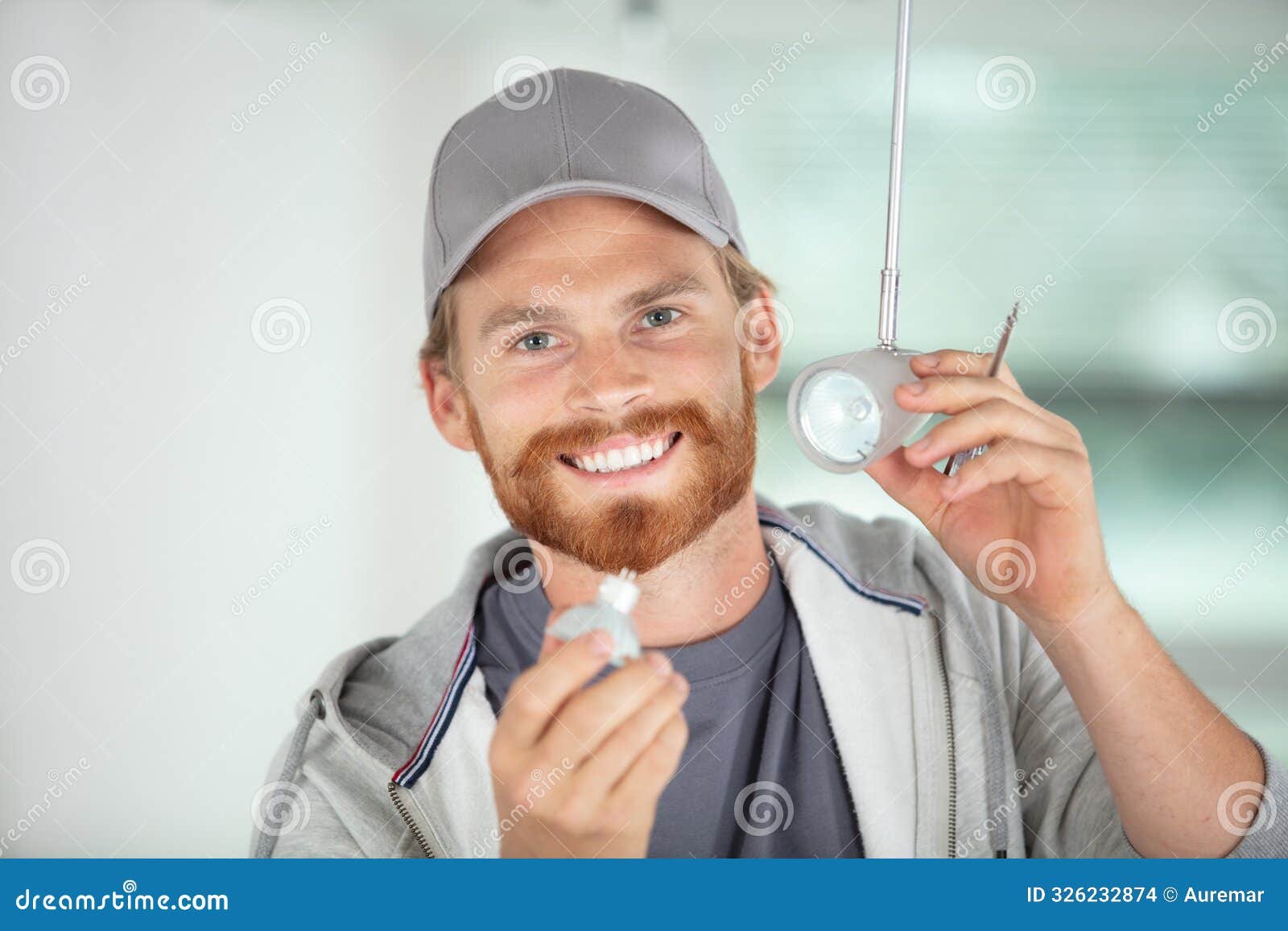 Asian Man Changing Light Bulb in Coffee Shop Stock Photo - Image of ...