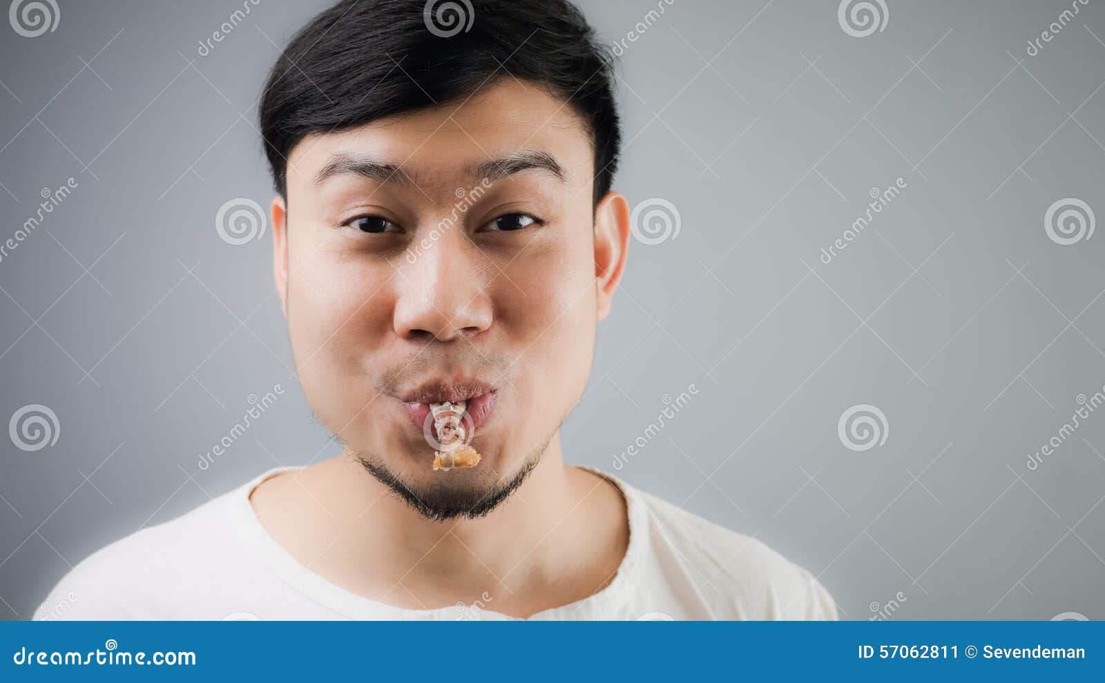 Asian Man with Chicken Bone. Stock Image - Image of meal, food: 57062811