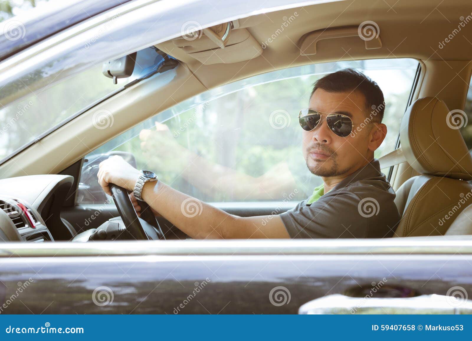 Asian man driving in car stock photo. Image of driver - 59407658