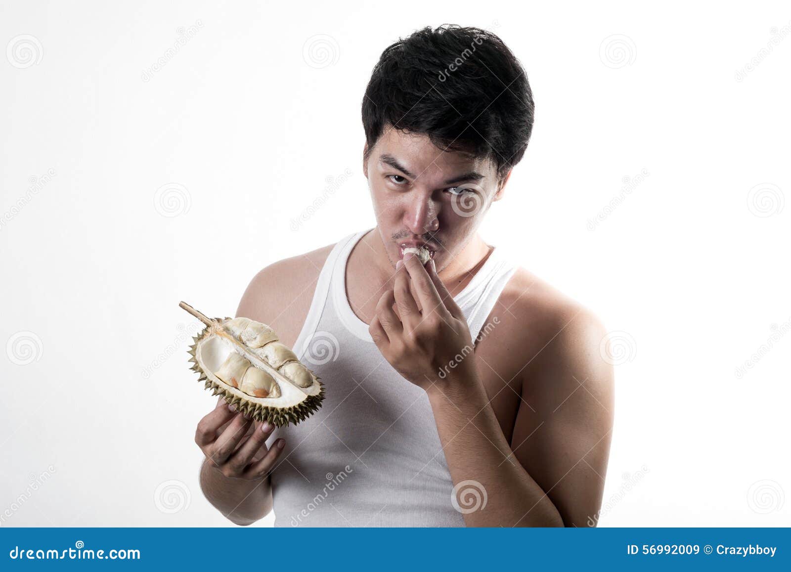 Asian man eating Durian stock image. Image of eating - 56992009