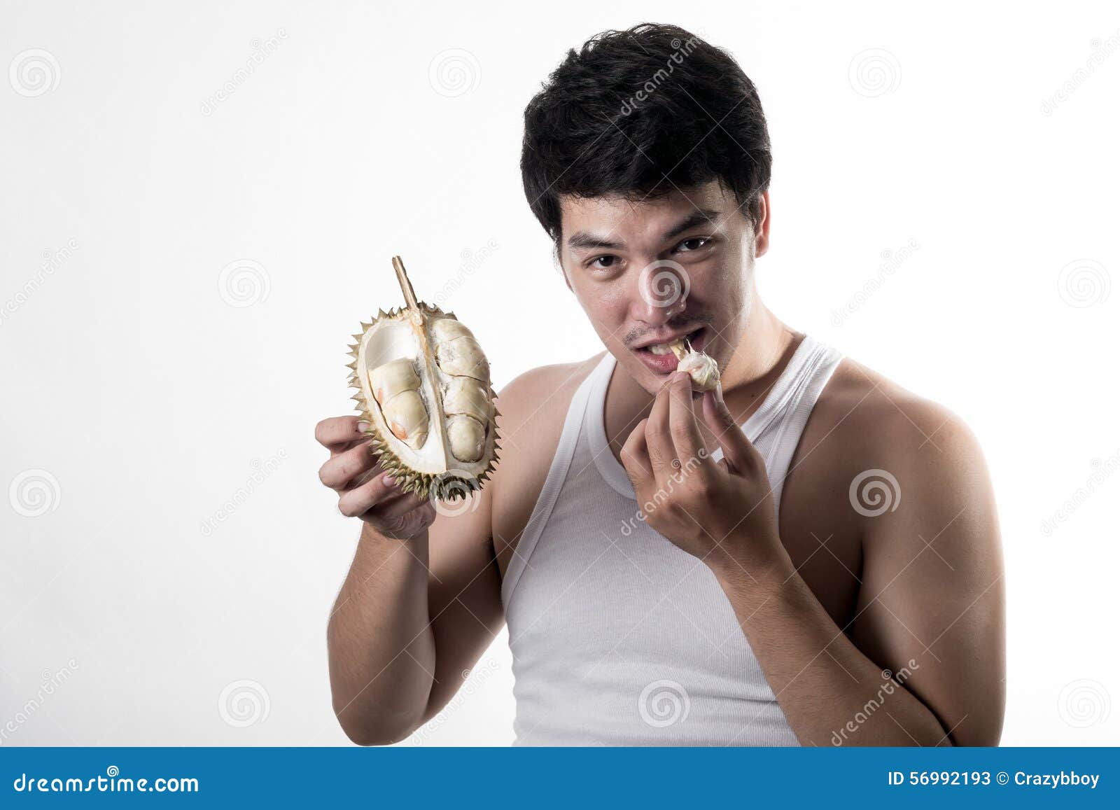Asian man eating Durian stock image. Image of hold, eating - 56992193
