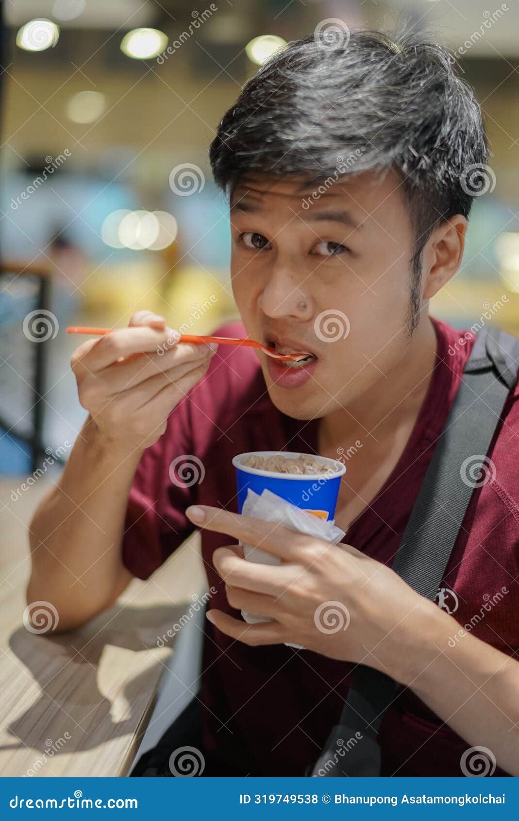 Asian Man Eating Ice Cream with Red Spoon Stock Photo - Image of ...