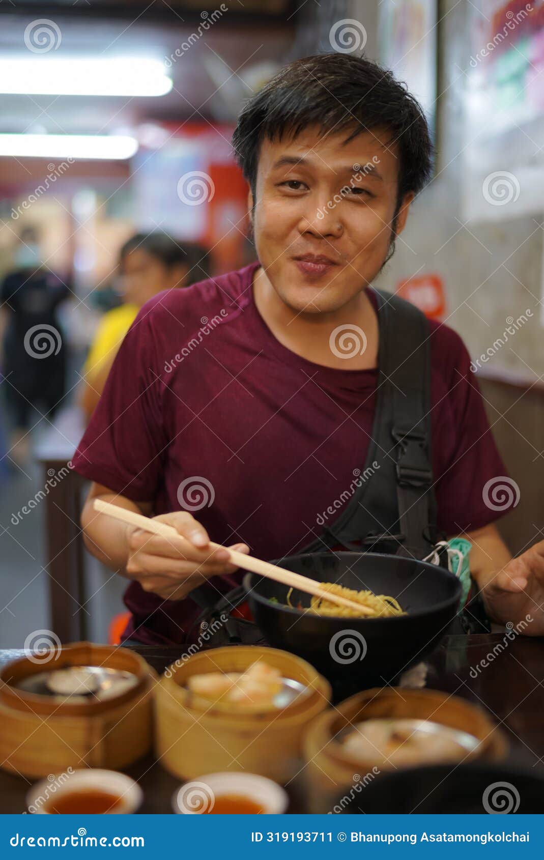 Asian Man Eating Noodle with Dim Sum on the Table Stock Image - Image ...