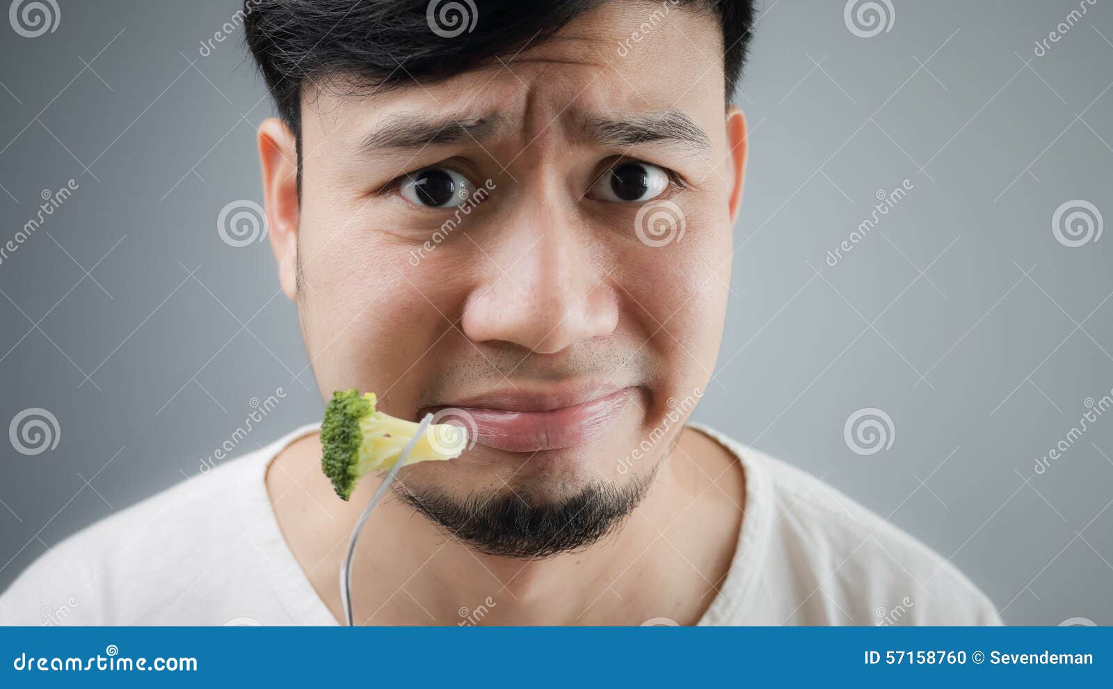 An Asian Man Eats Broccoli. Stock Photo - Image of meal, looking: 57158760