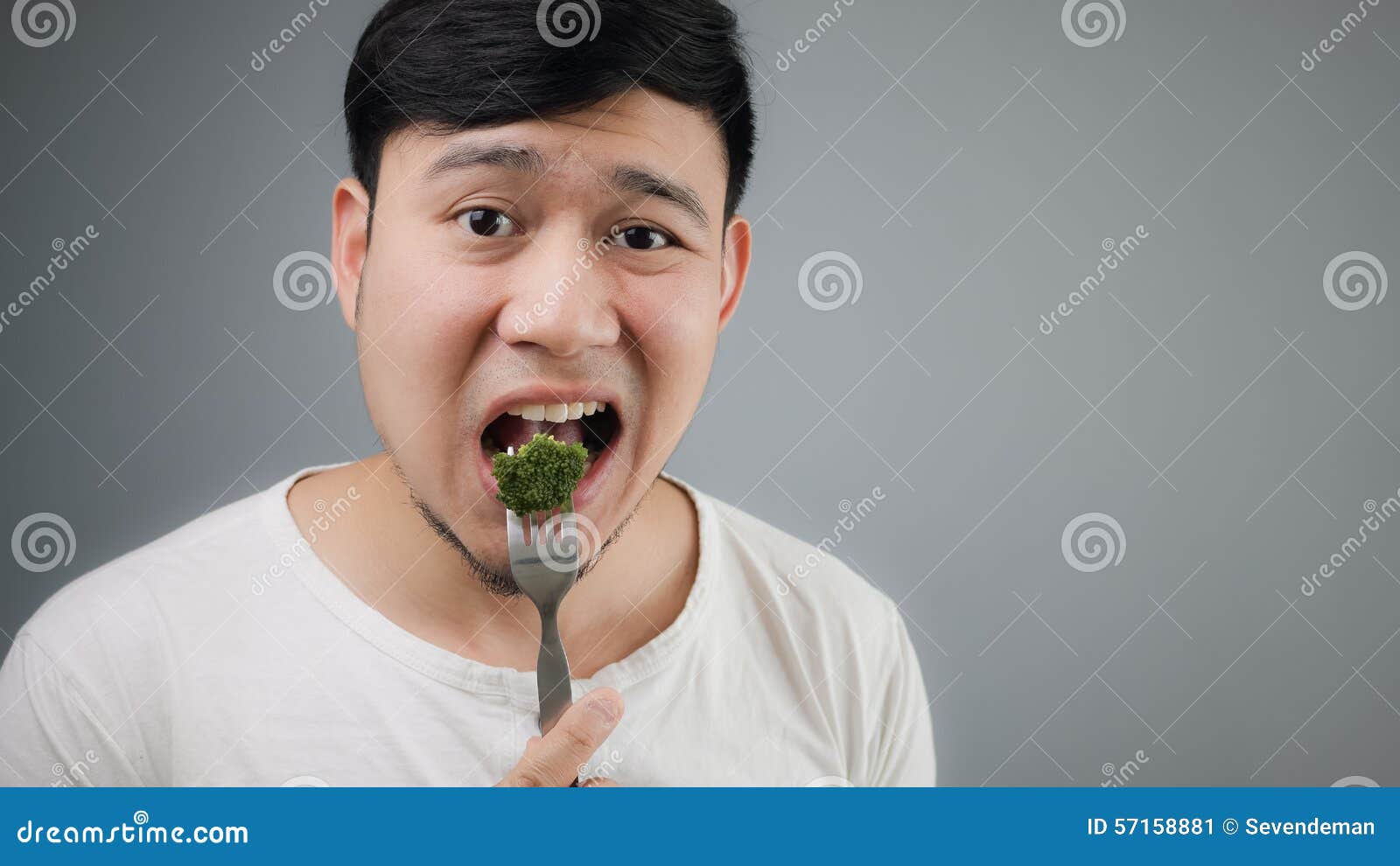 An Asian Man Eats Broccoli. Stock Image - Image of natural, person ...