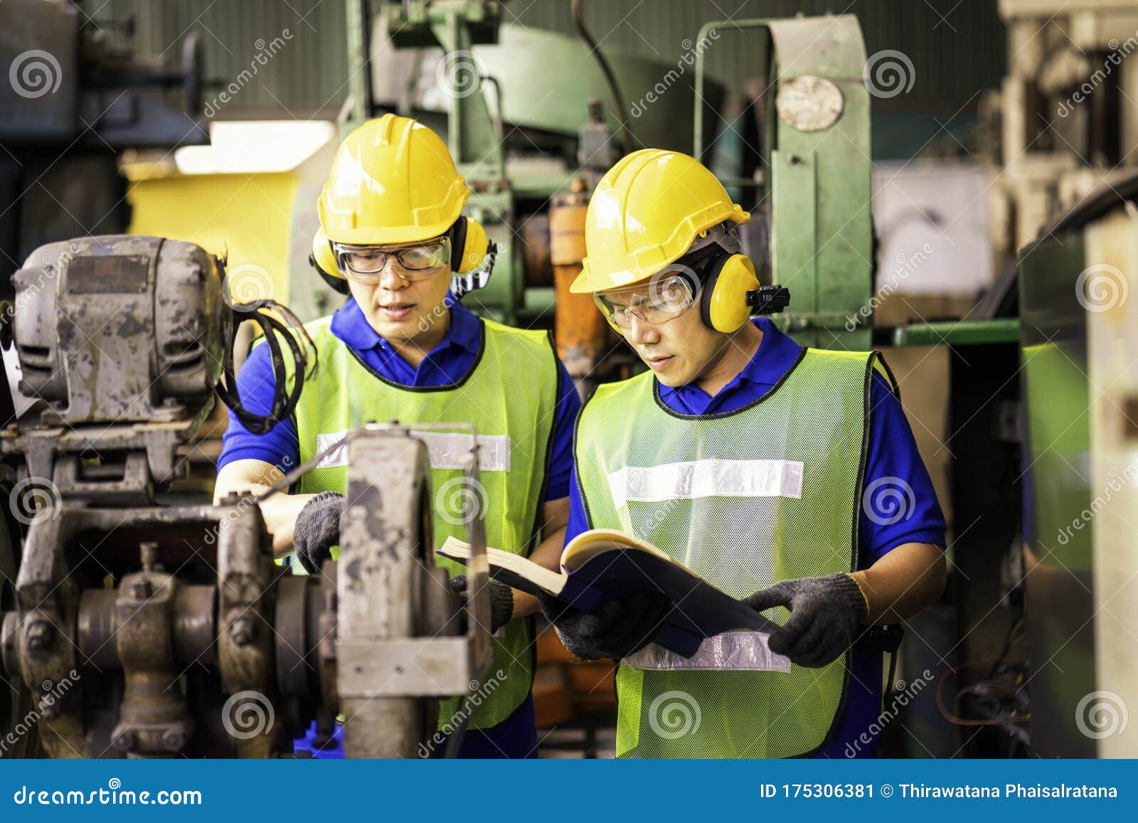 Technicians And Engineers Are Working In A Factory With Modern Machines ...