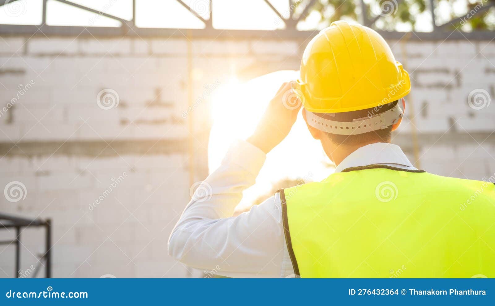Asian Man Engineer is Putting a Protective Helmet on His Head Stock ...
