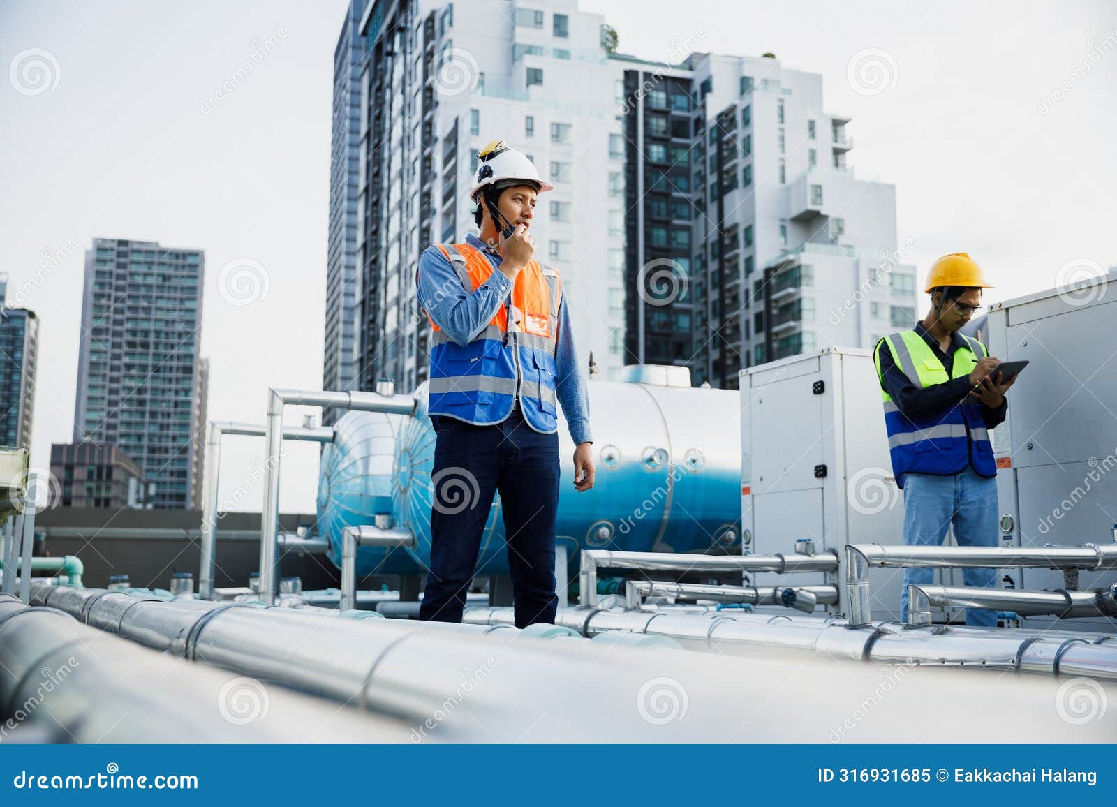 Asian Man Engineer Using Talkie Walkie Report Working at Rooftop ...