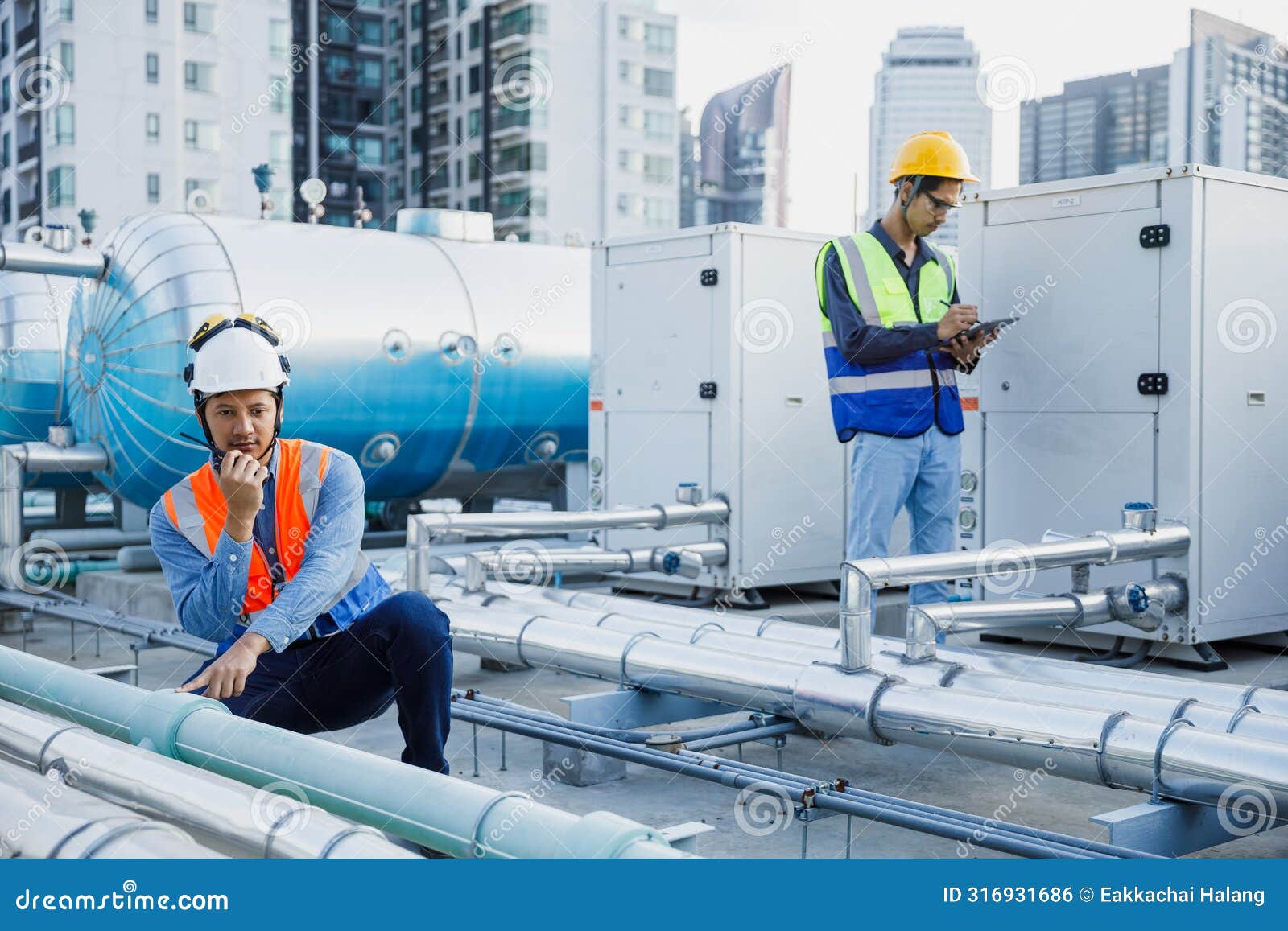 Asian Man Engineer Using Talkie Walkie Report Working at Rooftop Building Construction ...