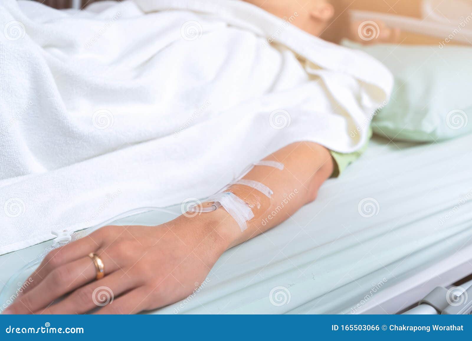 Asian Man Hand of a Patient with Saline Solution or IV Drip in Hospital ... Asian Man Hand of a Patient with Saline Solution or IV Drip in Hospital ...