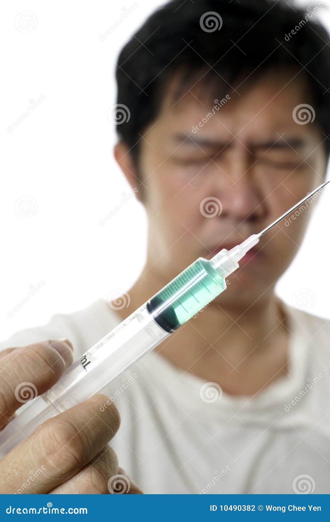 Asian man holding syringe stock photo. Image of closed - 10490382