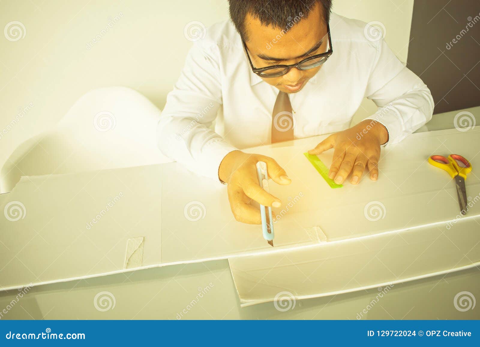 Asian Man Paper Cutting with Scissors for Crafts Paper and Create a ...