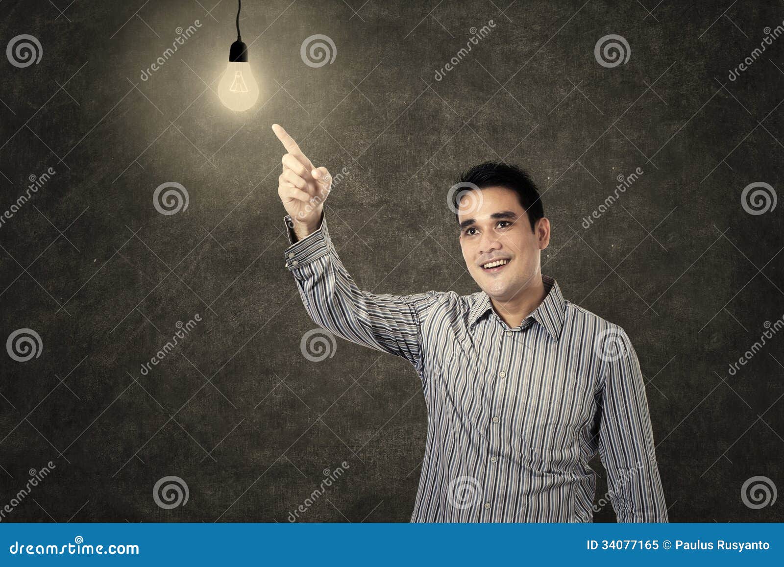 Asian Man Pointing a Lit Light Bulb Stock Image - Image of classroom ...