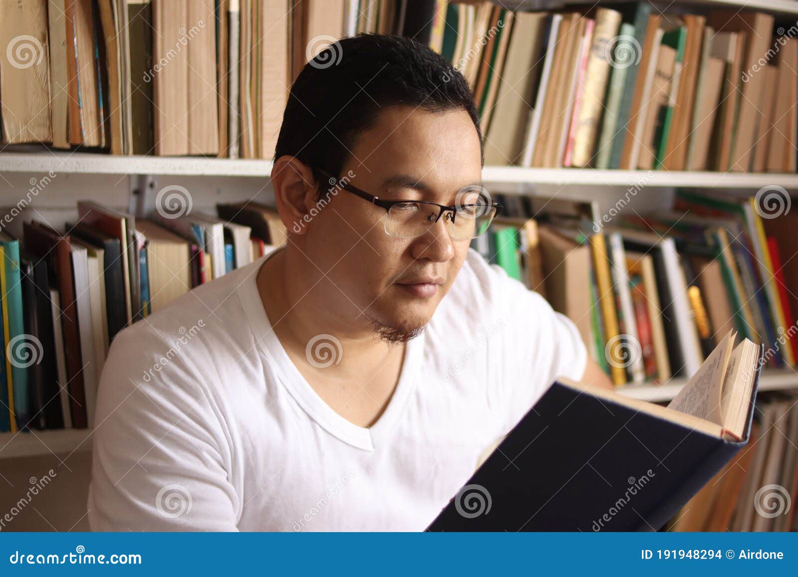 Asian Man Reading Book in Library, Educational Concept. Happy Smiling ...