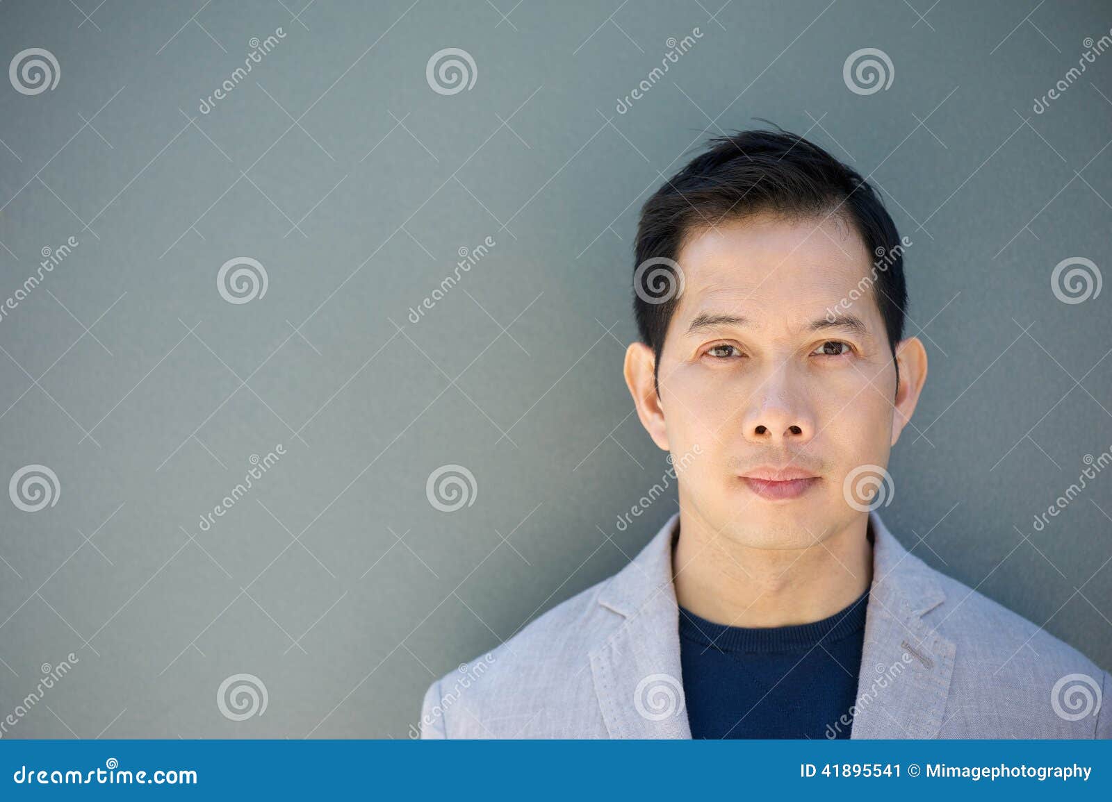 Asian Man with Serious Expression Stock Image - Image of gray, handsome ...