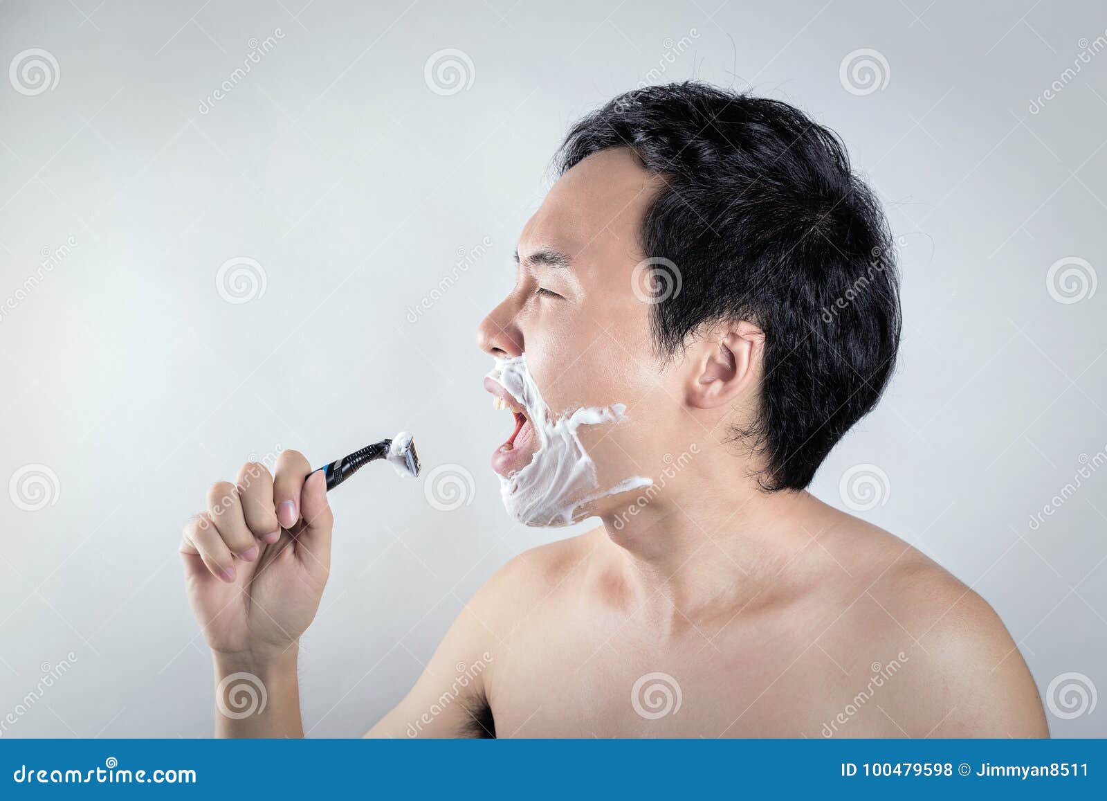 Asian man is shaving stock photo. Image of adult, beauty - 100479598