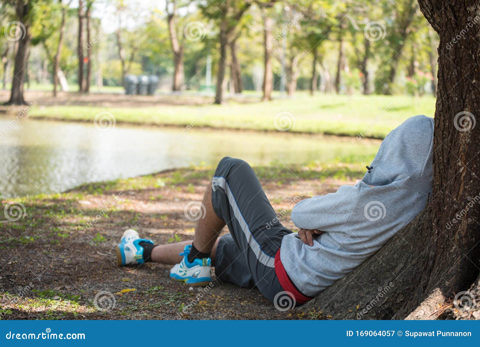 Asian Man Sleeping Under a Tree after Exercise Stock Image - Image of ...