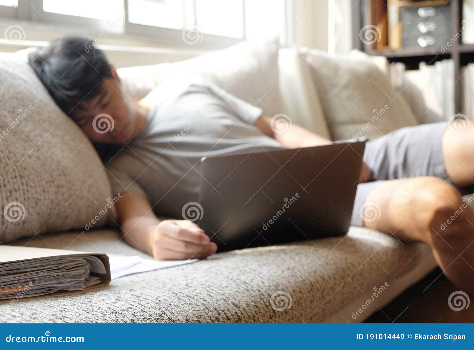 Asian Man Sleeping while Working Form Home on Sofa Stock Image - Image ...