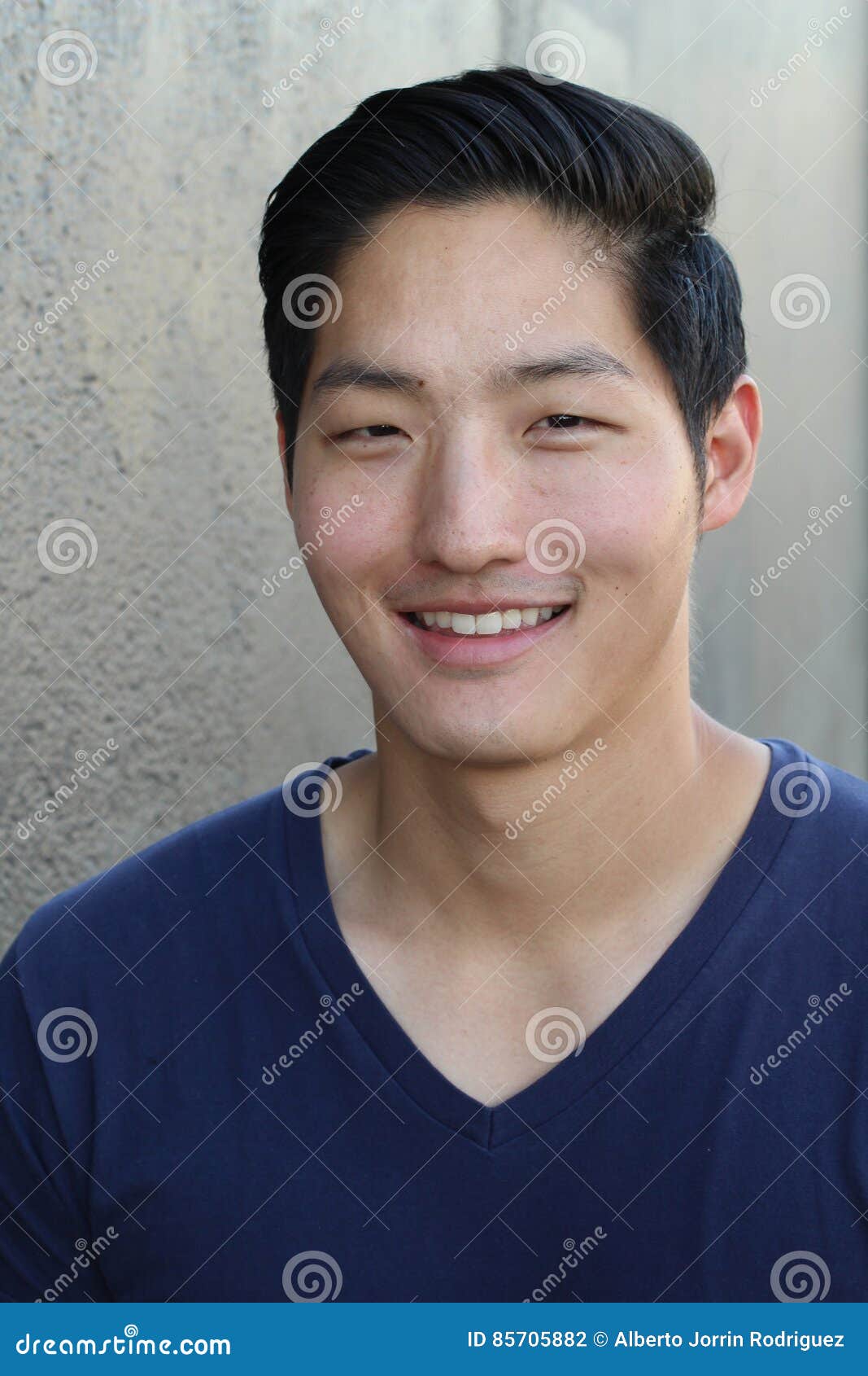 Asian Man Smiling on a Gray Background - Stock Image Stock Photo ...
