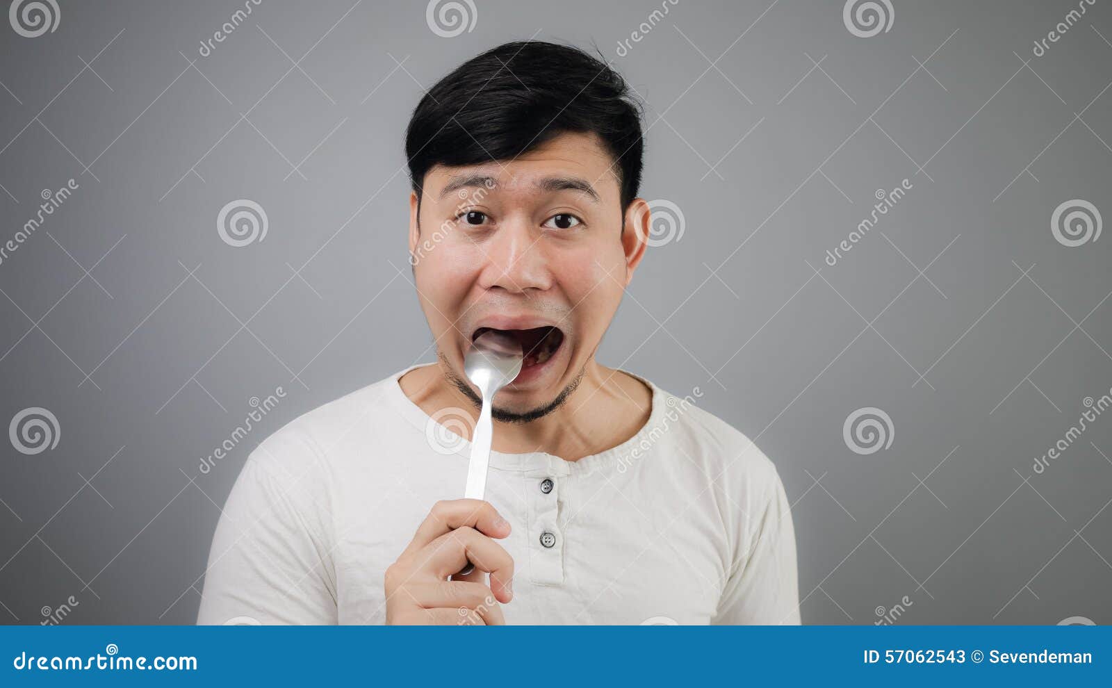 An Asian man with spoon. stock image. Image of diet, male - 57062543
