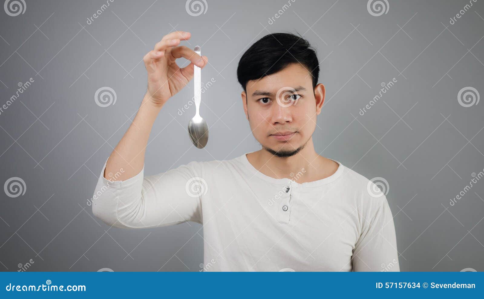 An Asian man with spoon. stock photo. Image of young - 57157634