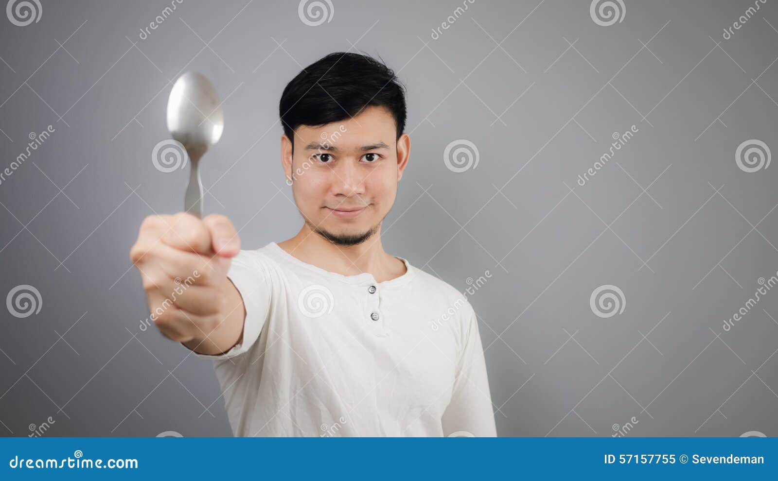 An Asian man with spoon. stock image. Image of smile - 57157755