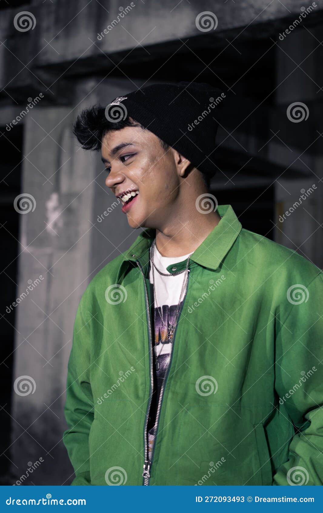 An Asian Man is Standing in an Abandoned Building in an Eccentric ...