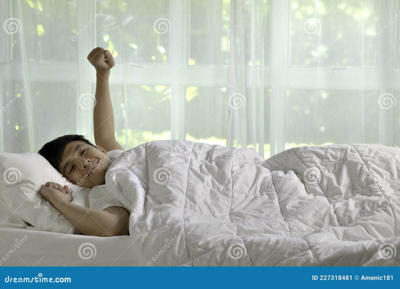 Asian Man Stretching in Bed after Wake Up in the Morning Stock Image ...