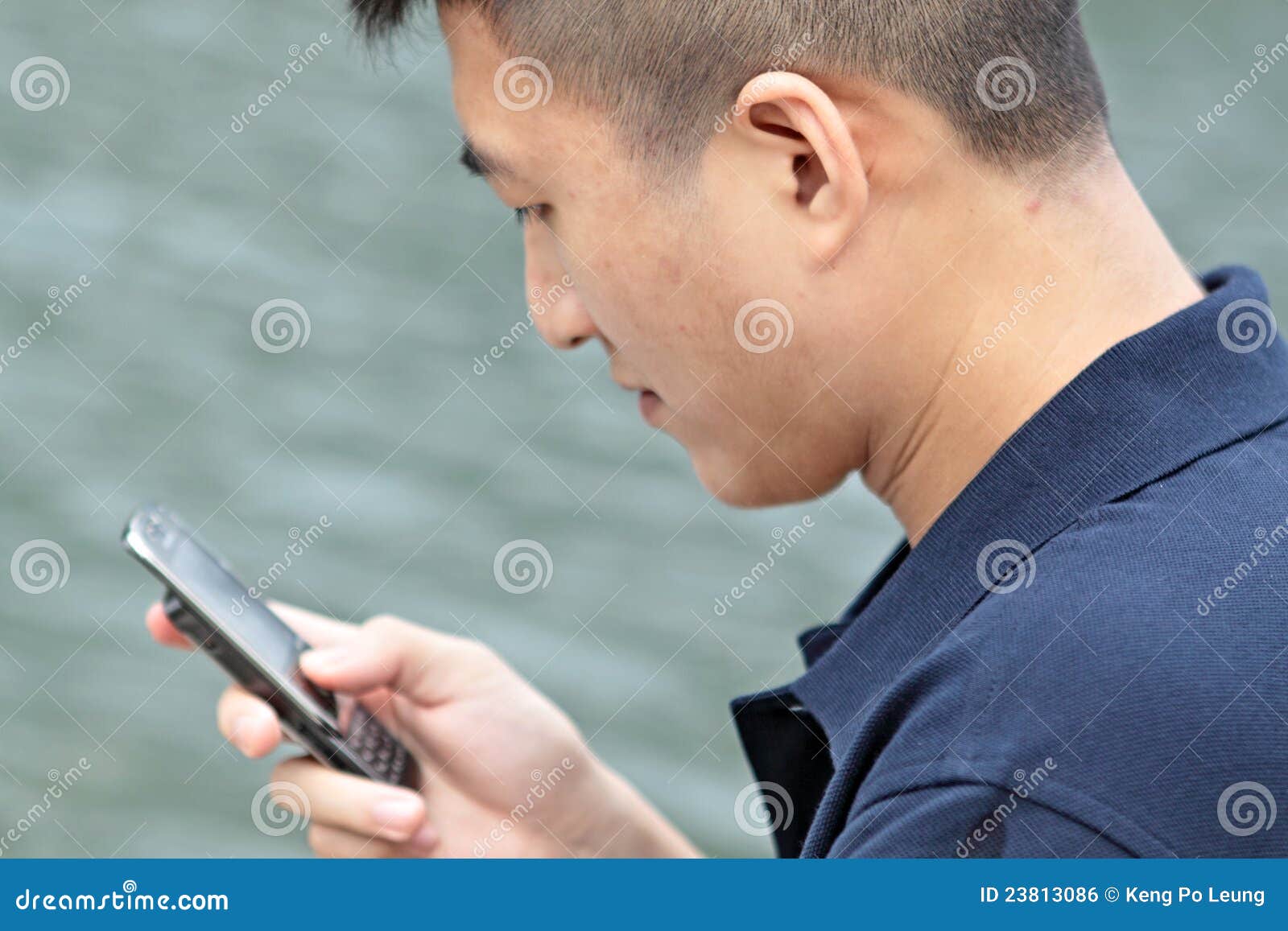 Asian man talking on phone stock photo. Image of male - 23813086