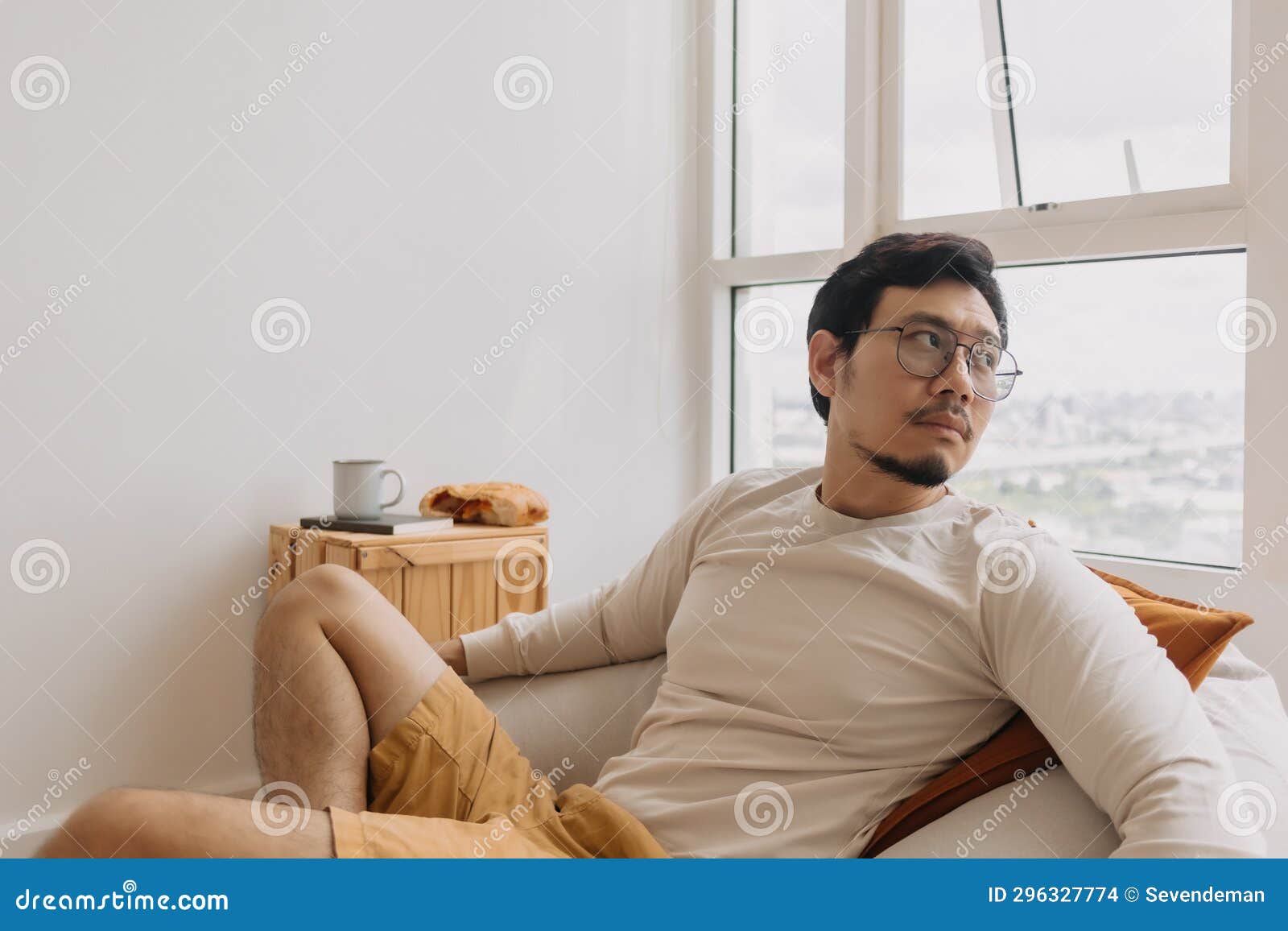 Asian Man Thinking and Missing Sits on Bean Bag and Relaxed in Weekend ...