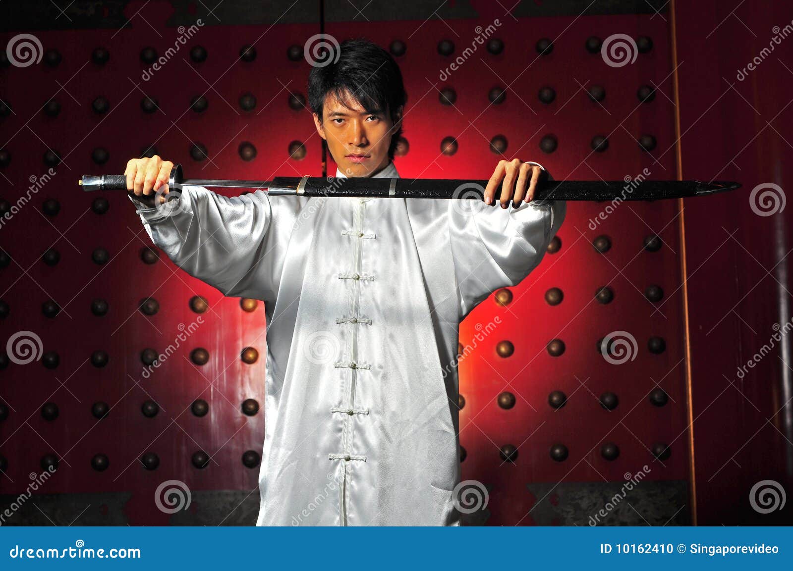 Asian Man Unsheading a Sword Stock Photo - Image of strong, protect ...