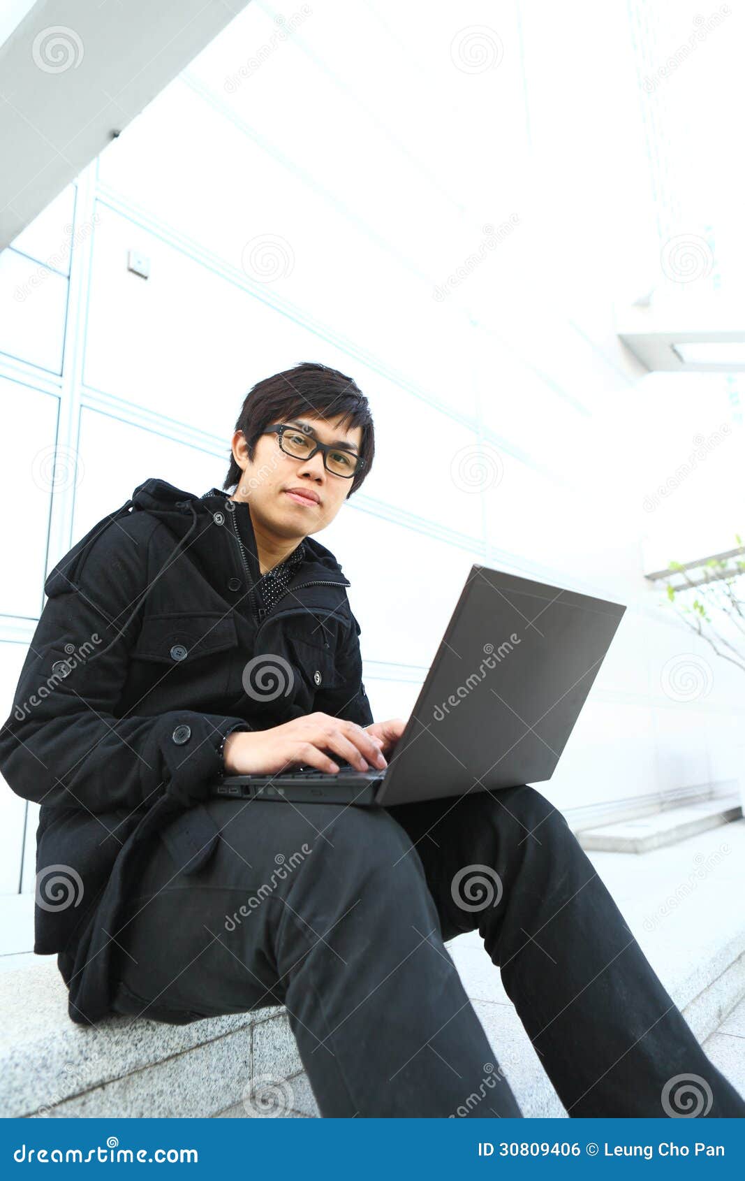 Asian man using computer stock photo. Image of glasses - 30809406
