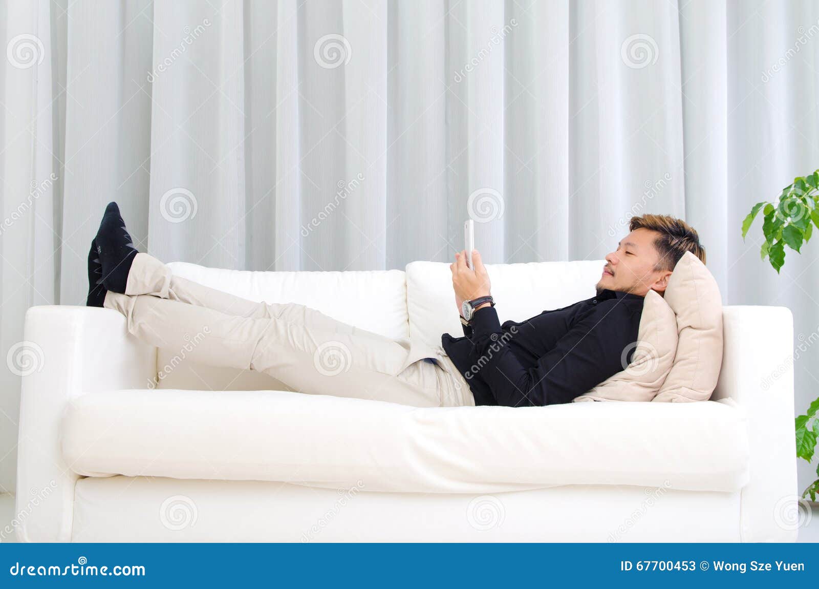 Asian man using handphone stock image. Image of handphone - 67700453