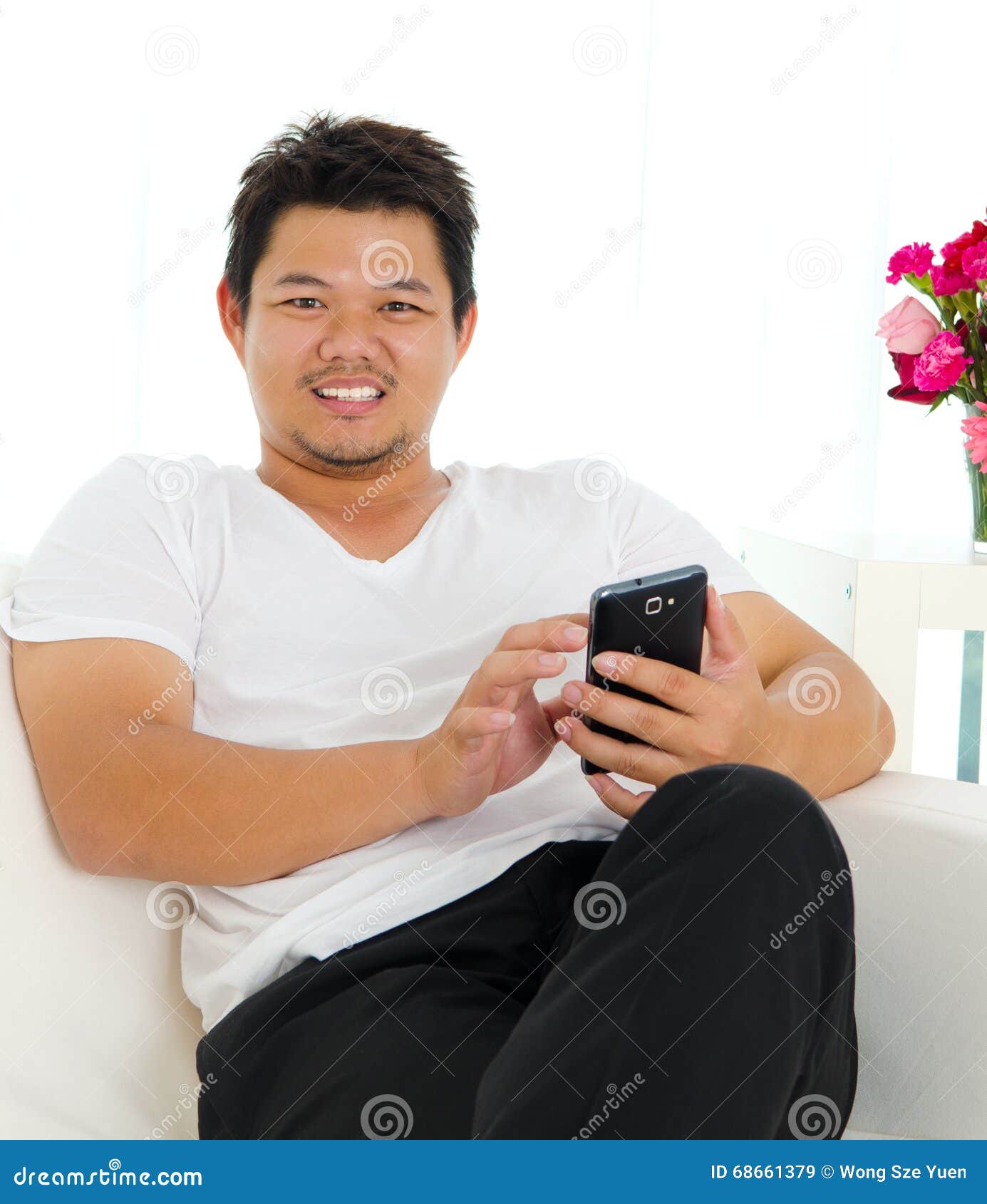 Asian man using handphone stock image. Image of handsome - 68661379