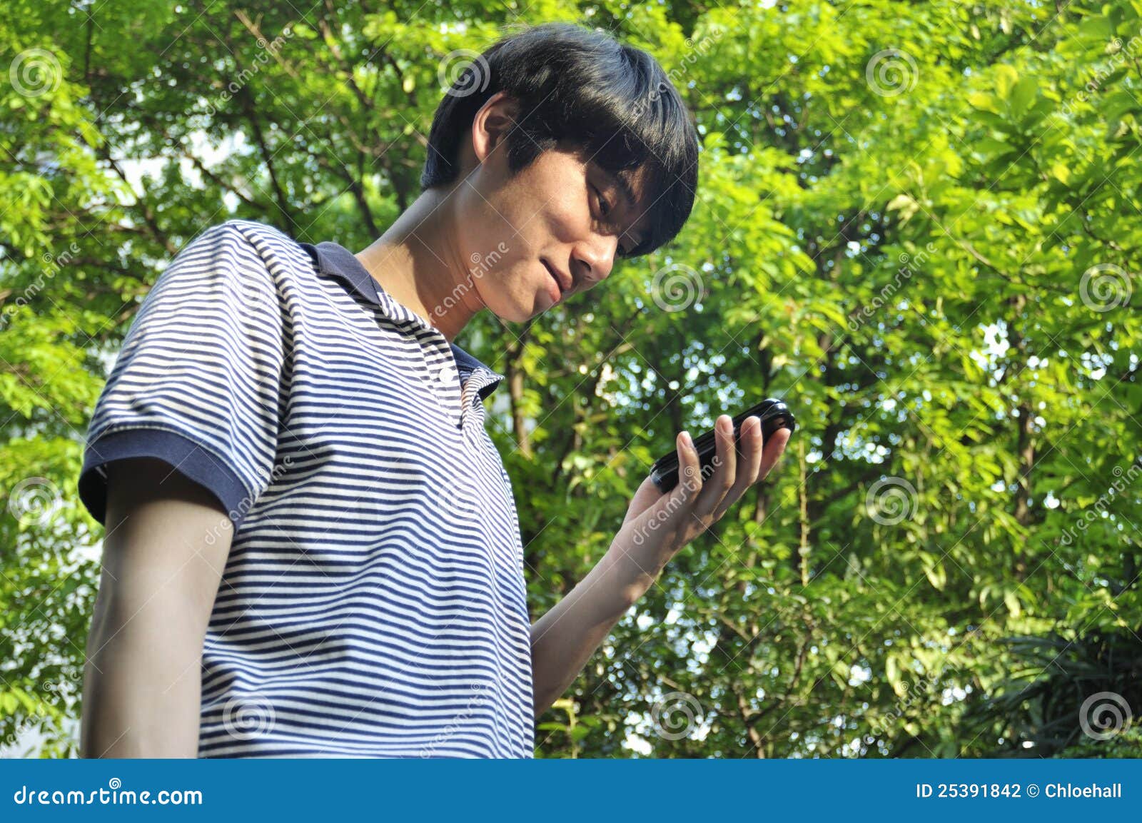 Asian Man Using Mobile Phone Stock Photo - Image of call, happy: 25391842