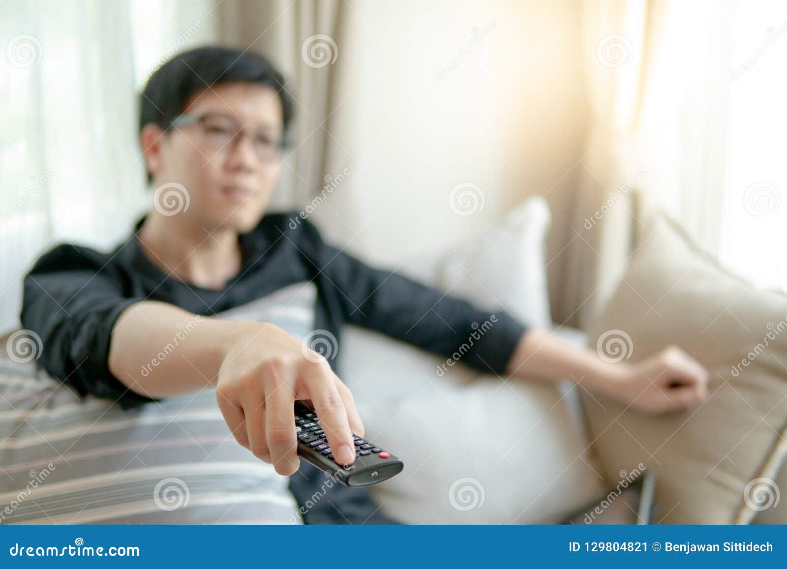 Asian Man Using Remote Controller while Watching TV Stock Image - Image ...
