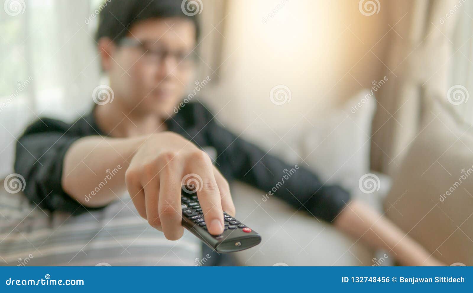 Asian Man Using Remote Controller while Watching TV Stock Photo - Image ...