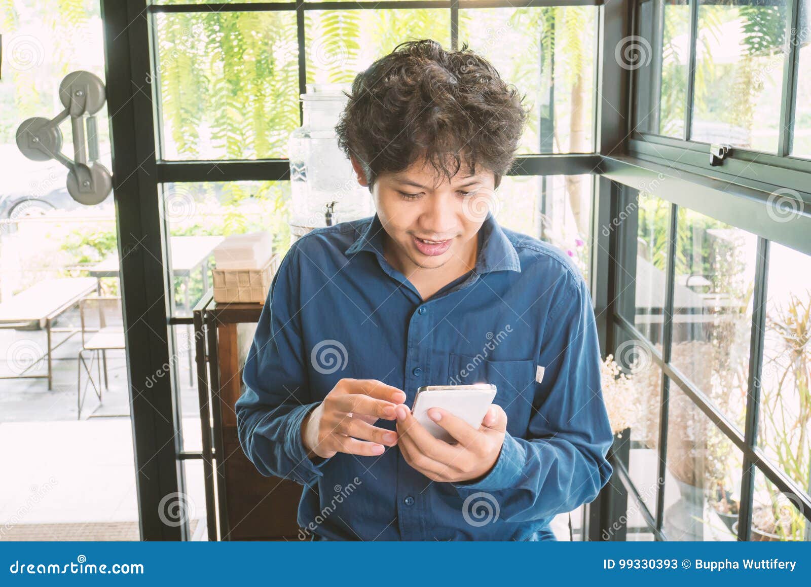 Asian man using smartphone stock image. Image of smart - 99330393