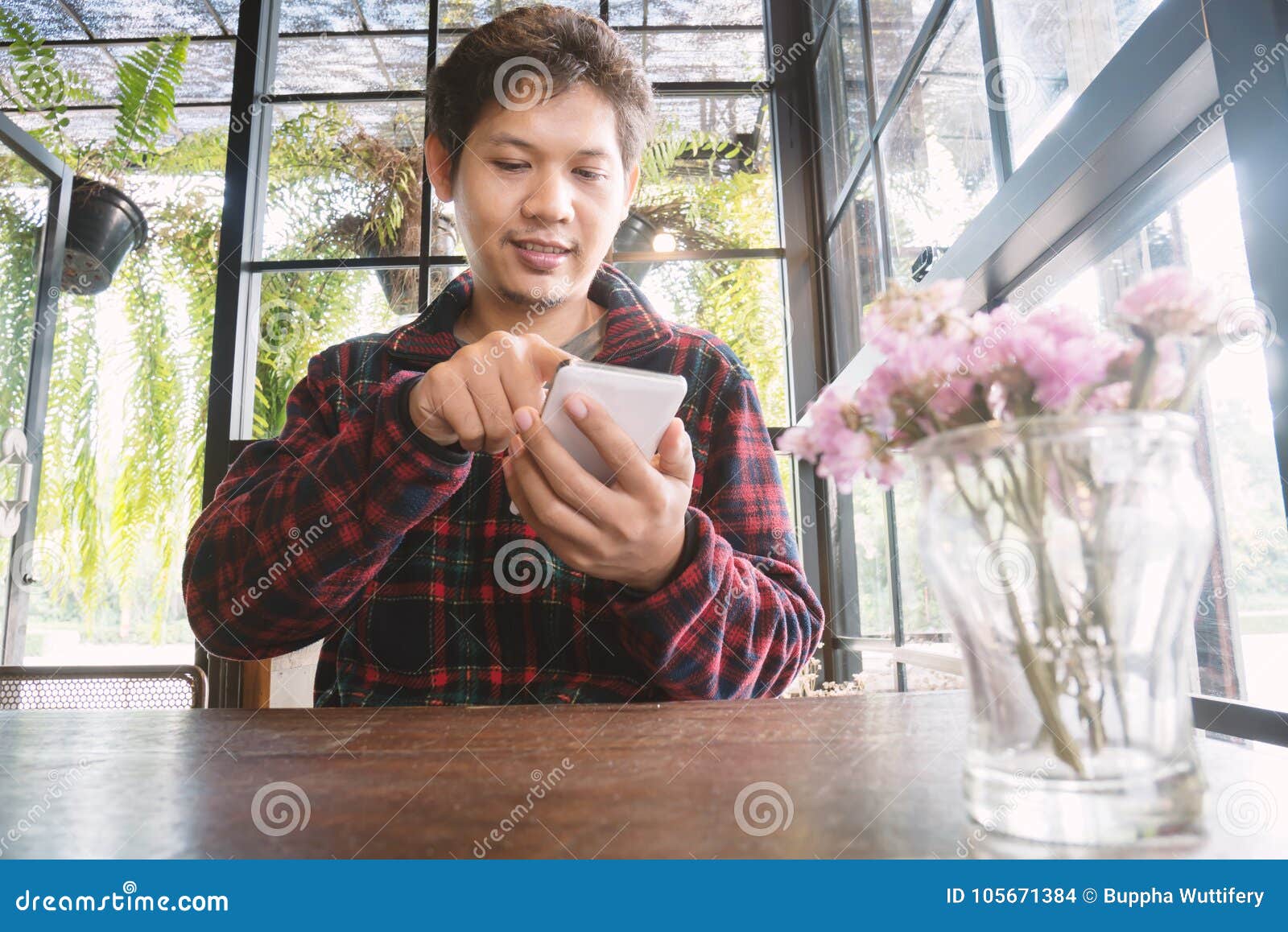 Asian Man Using Smartphone in the Coffee Shop Stock Photo - Image of ...