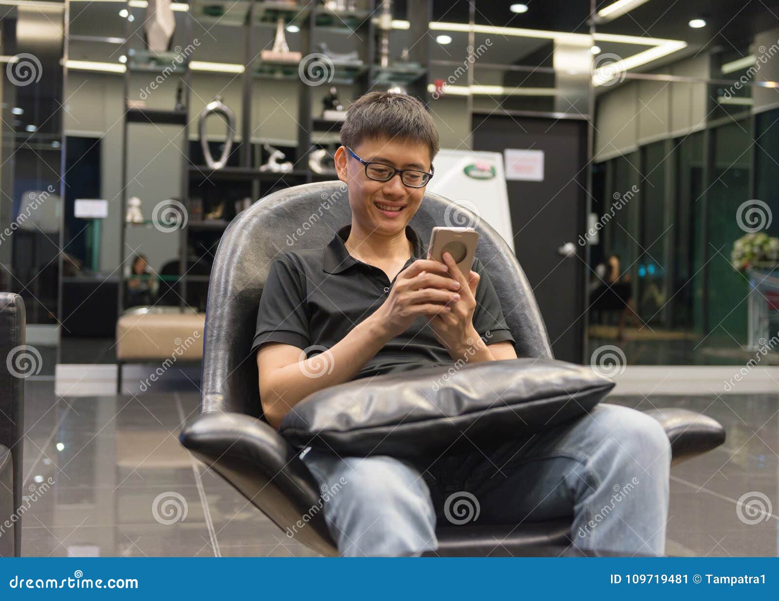 Asian Man Using a Smartphone in Living Room at Night Stock Image ...