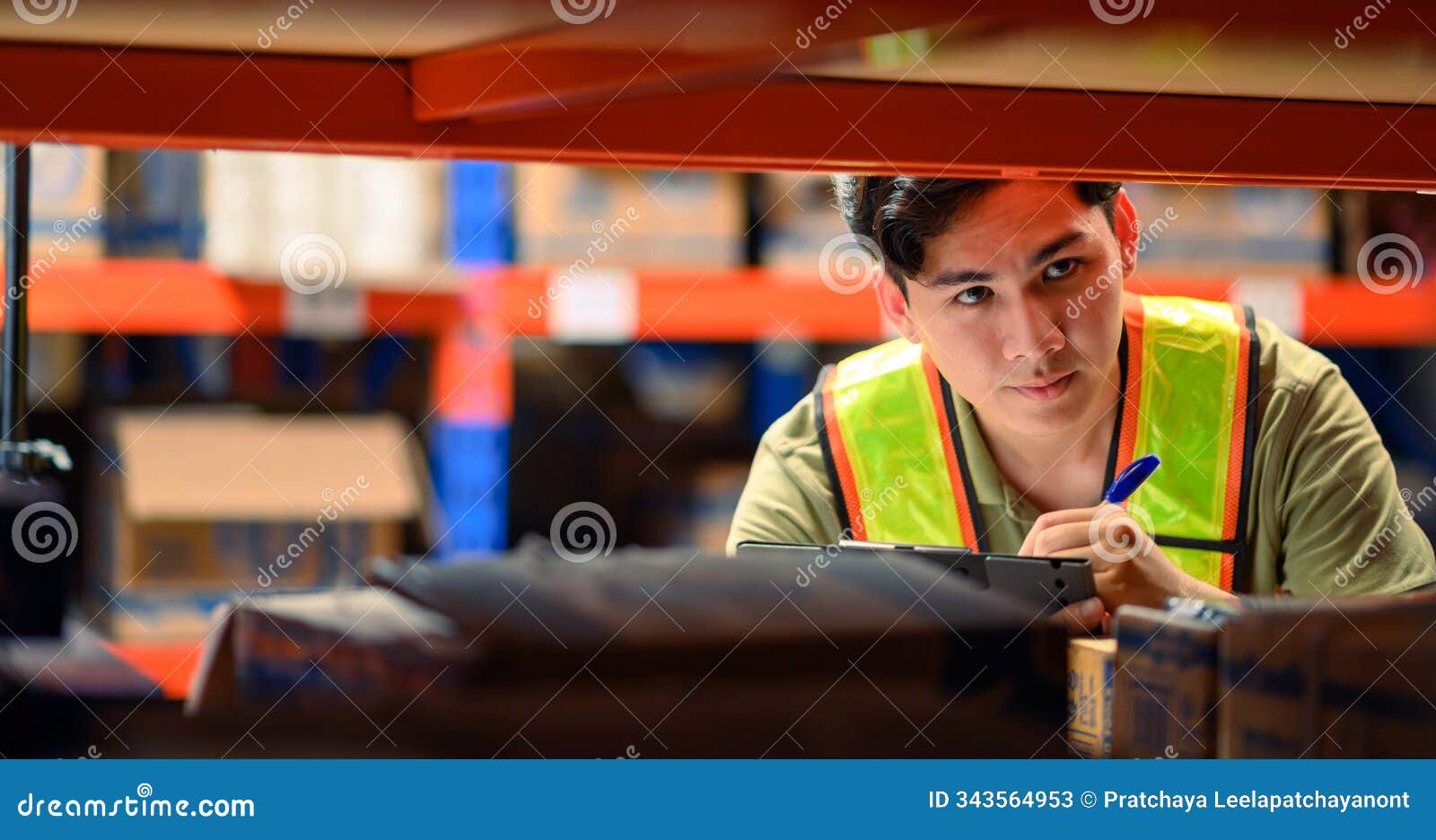 Asian Logistic Worker Woman In Uniform Talking On Walkie Talkie To ...