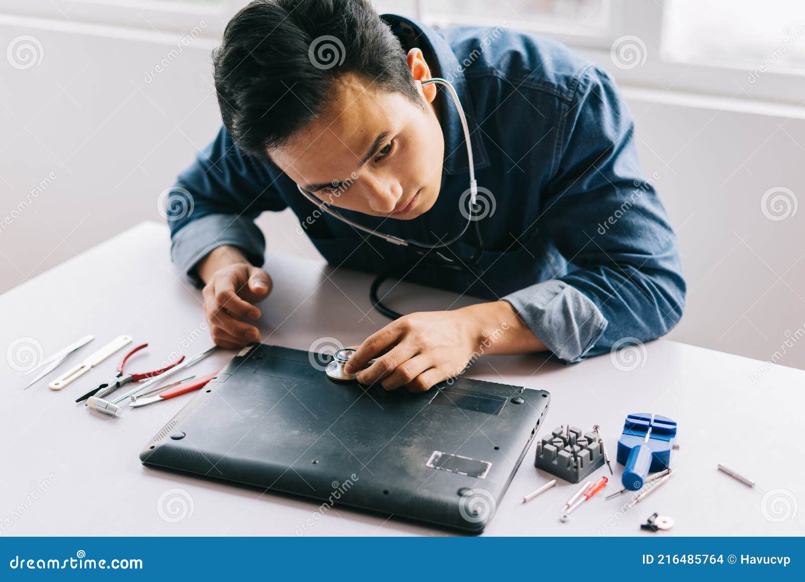 The Asian Man Was Taking Out a Broken Computer To Repair it Stock Photo ...