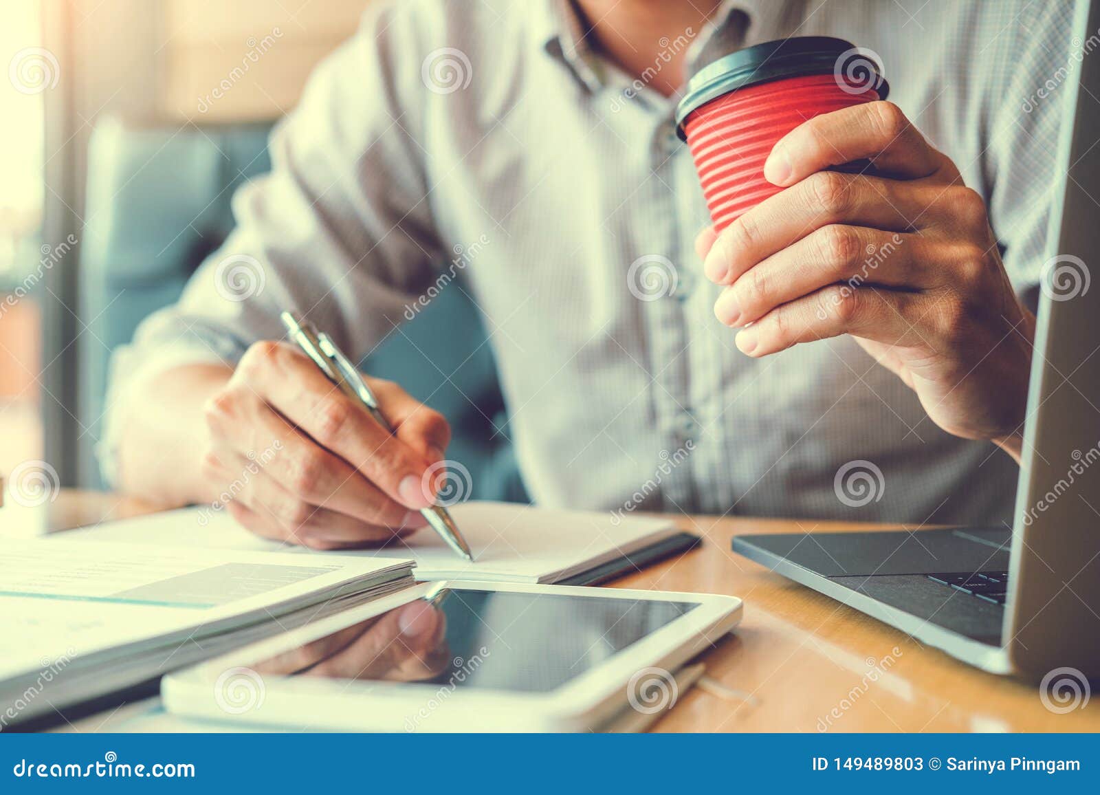 Asian Man Write a Report and Using Laptop Computer Working on His New ...