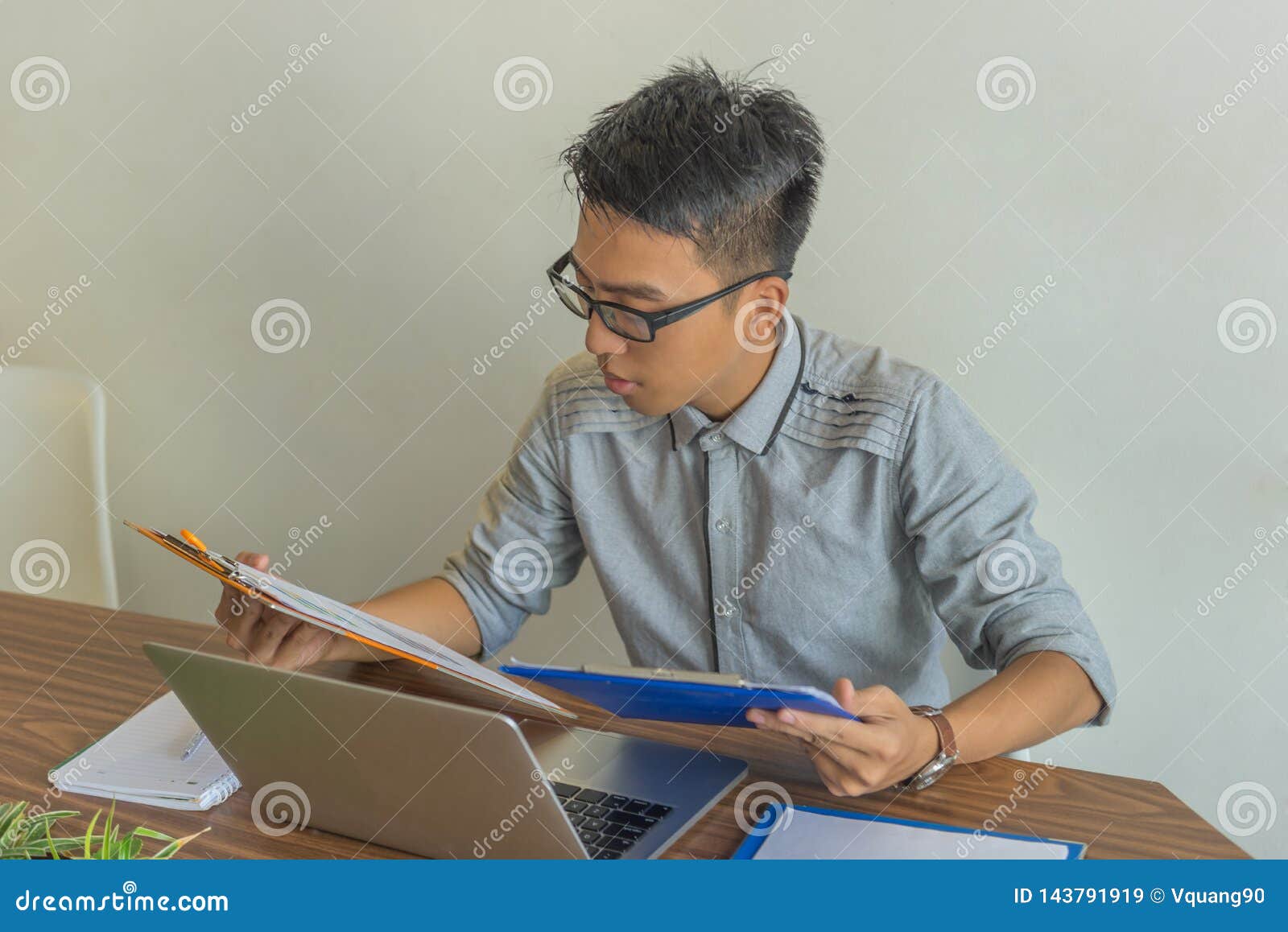 Asian Manager Reading Reports in the Office Stock Image - Image of note ...