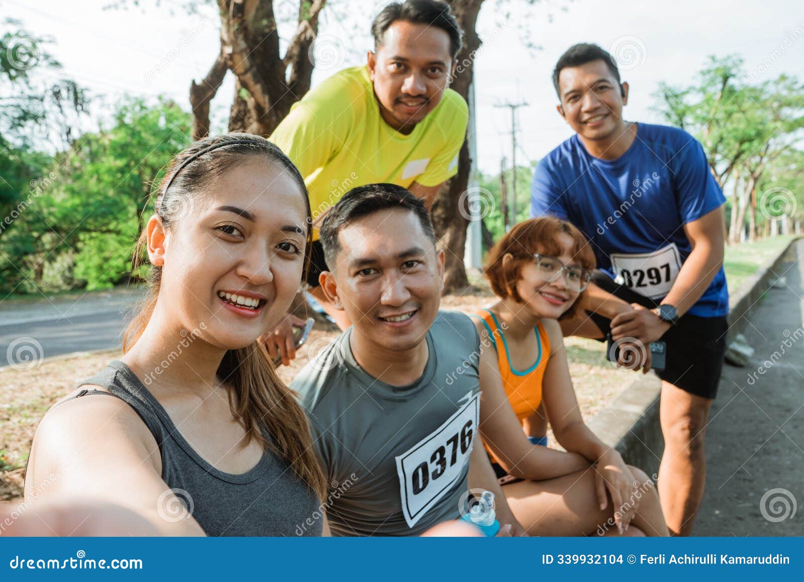 Asian Marathon Runner Sitting and Posing Together Stock Photo - Image ...