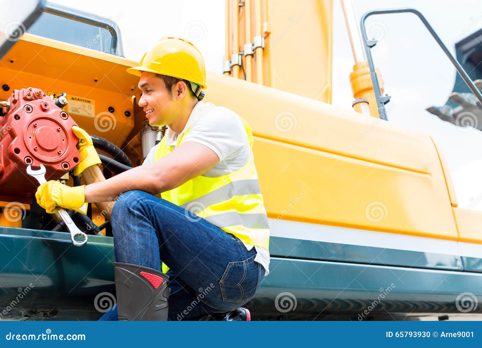 Asian Mechanic Repairing Construction Vehicle Stock Photo - Image of ...