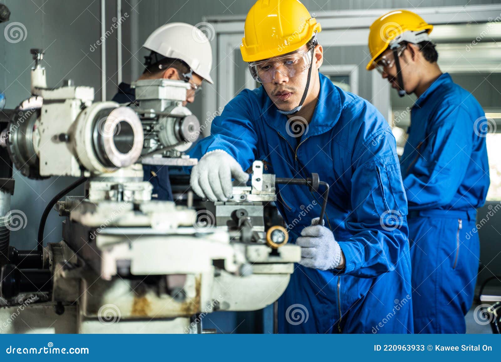 Asian Mechanical Workers Working on Milling Machine. the Technicians ...