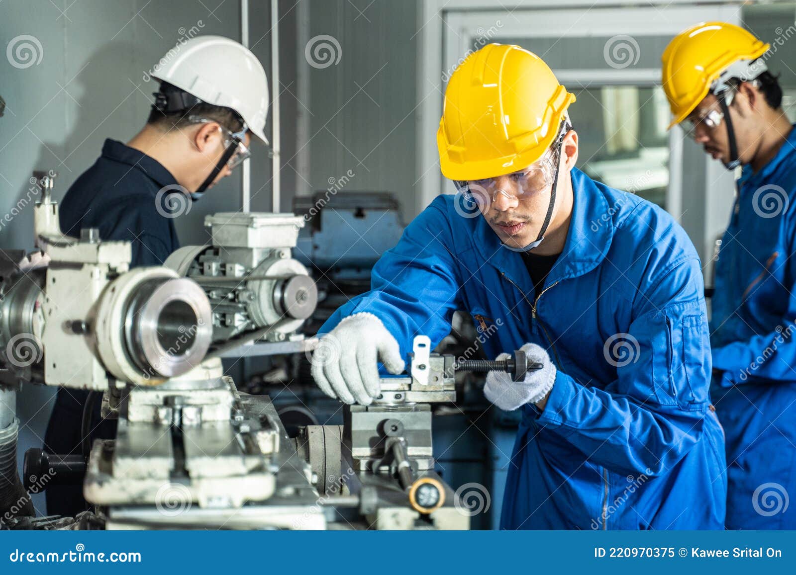 Asian Mechanical Workers Working on Milling Machine. the Technicians ...